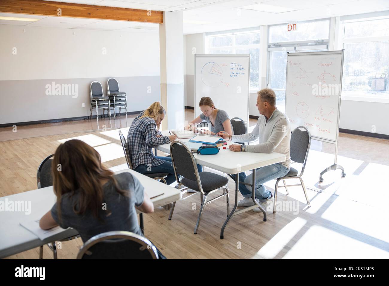 Preteen student and teacher talking hi-res stock photography and images - Alamy