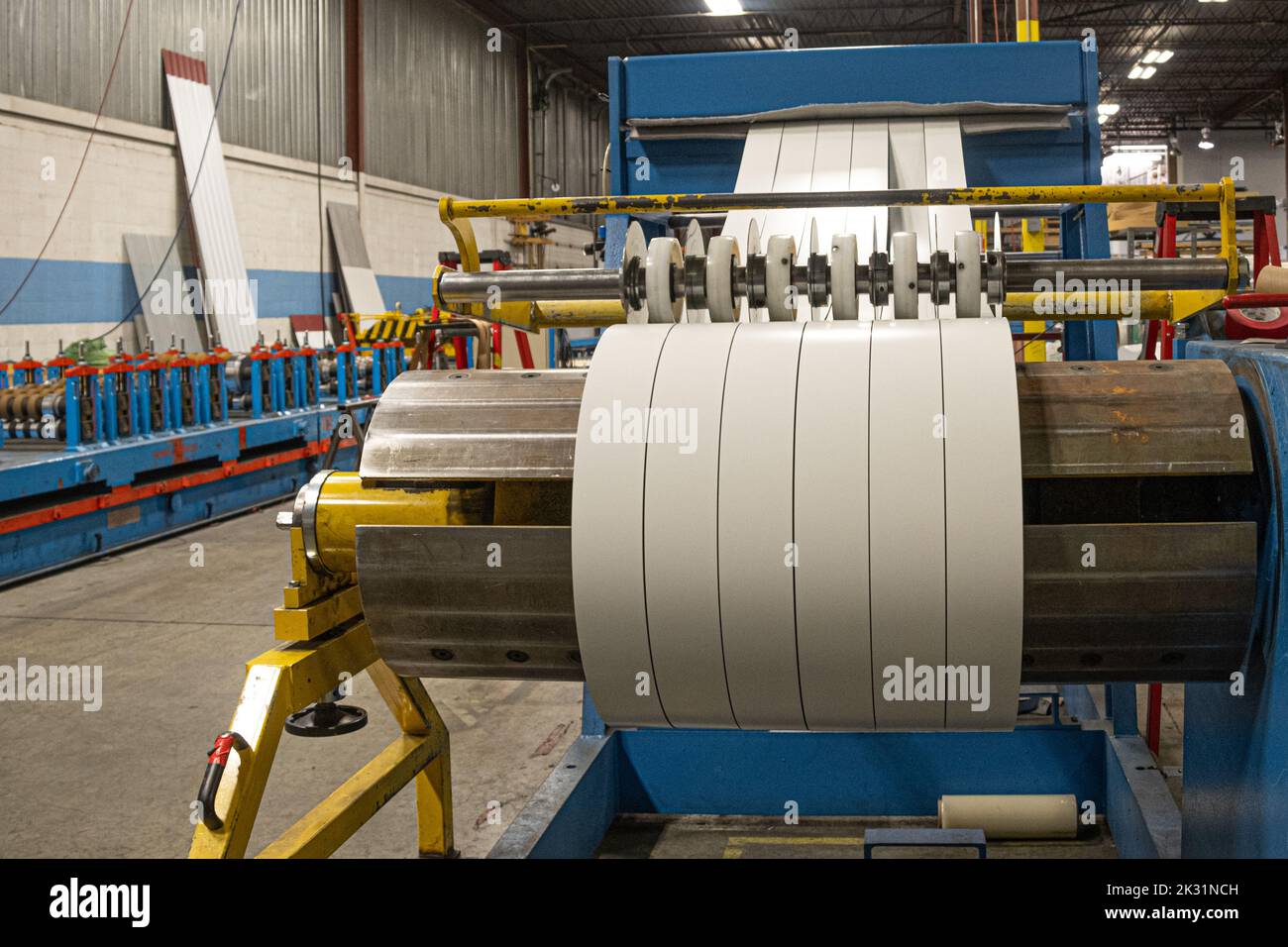 metal roll of coil on decoiling machine Stock Photo - Alamy