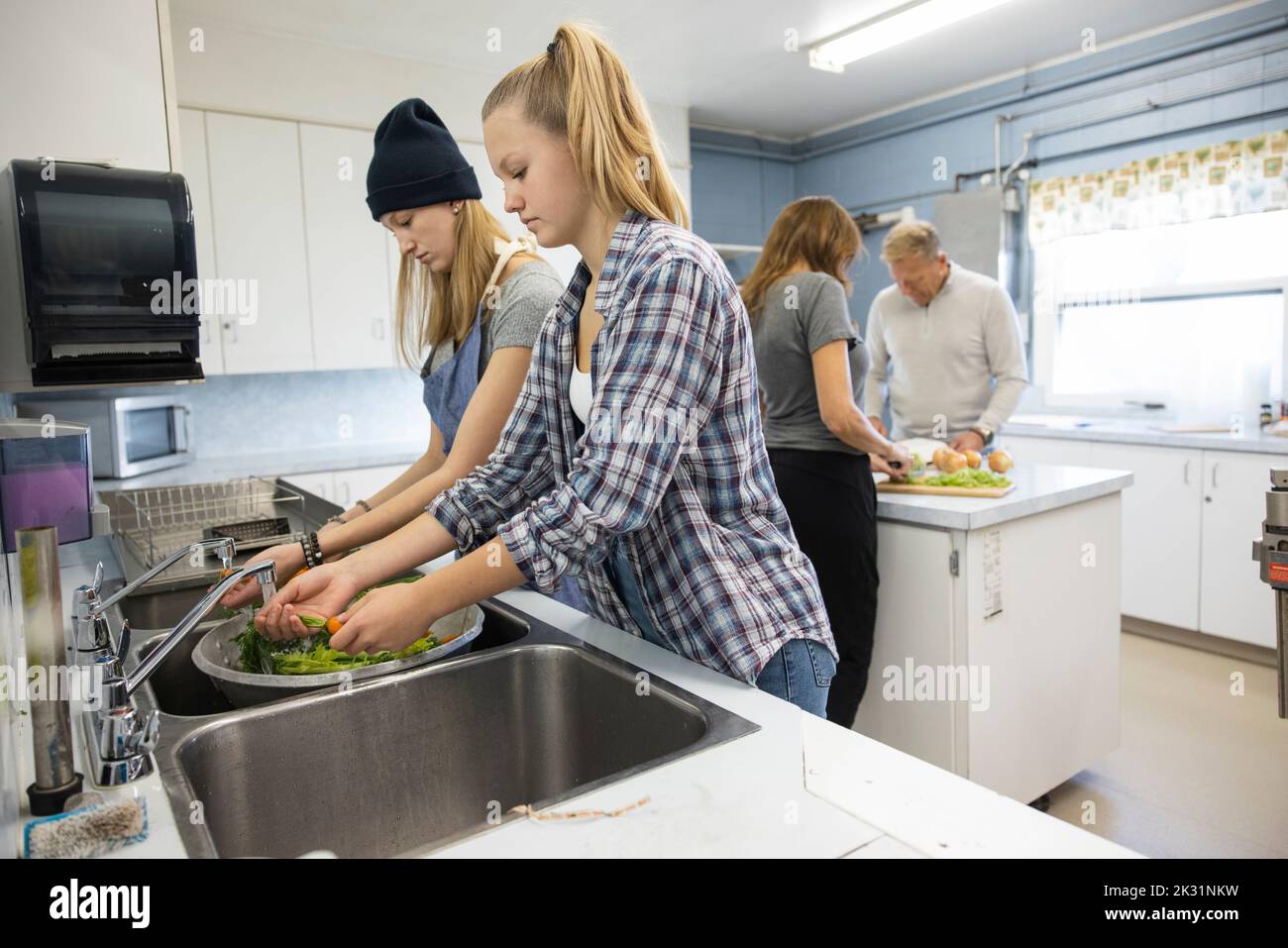 Child wash vegetables sink hi-res stock photography and images - Alamy
