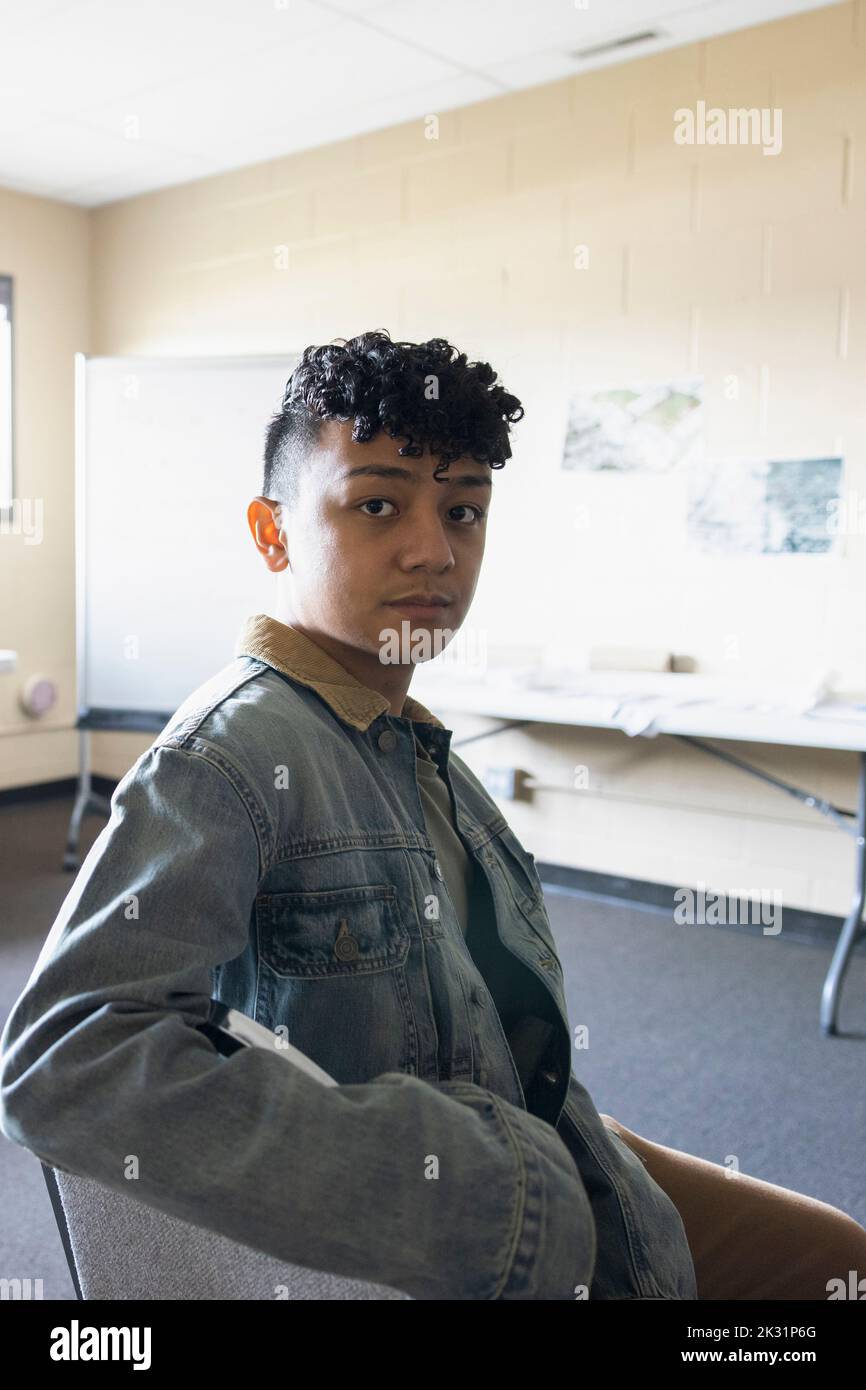 Portrait confident young man in community center Stock Photo - Alamy