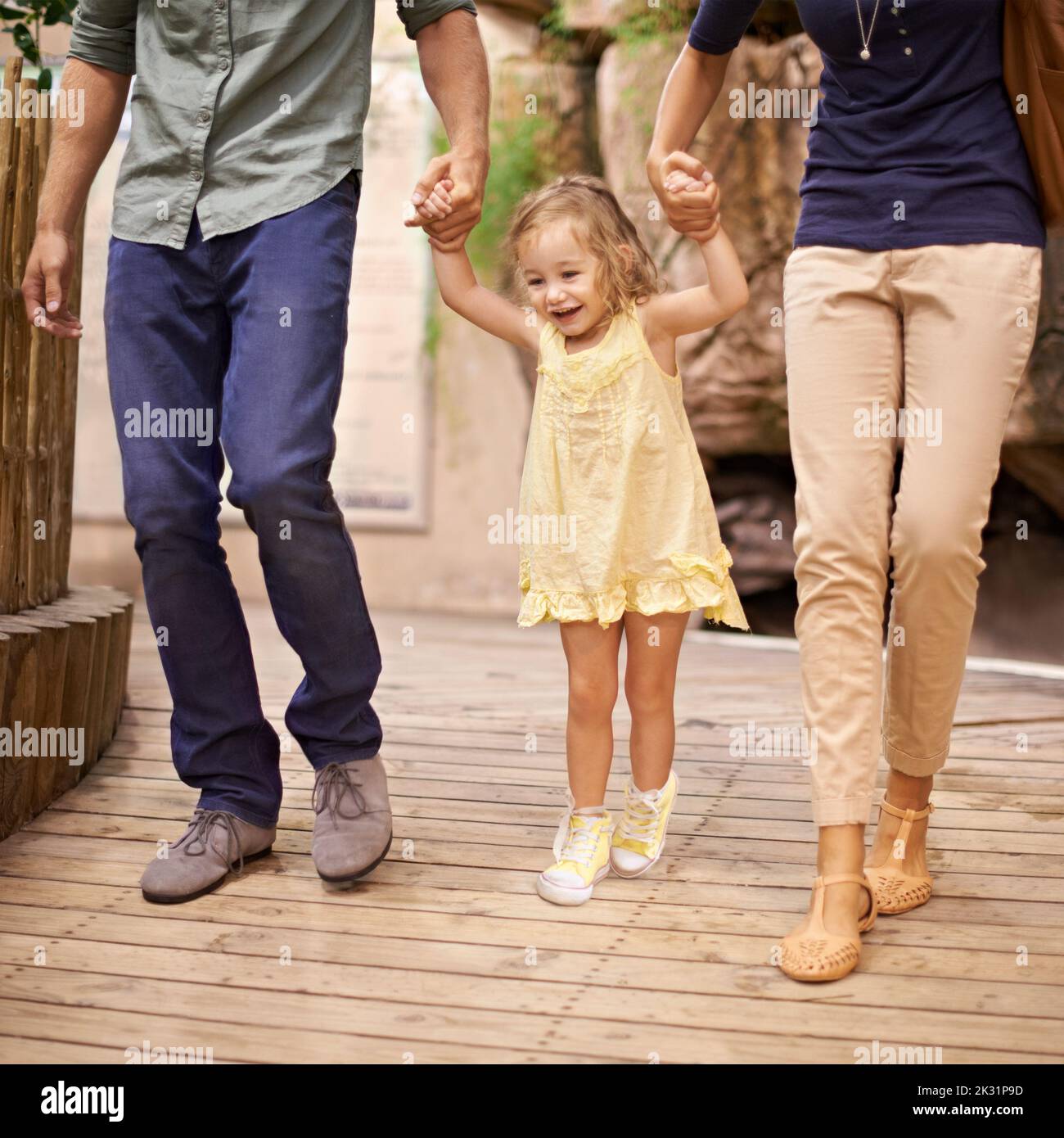 Yippee Were going on an adventure. A little girl holding her parents ...