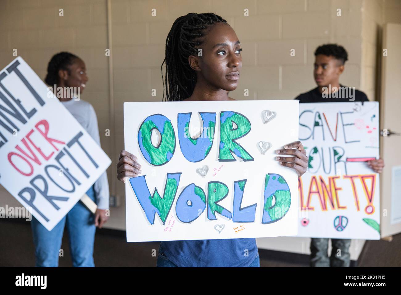 Female activist holding sign hi-res stock photography and images - Alamy