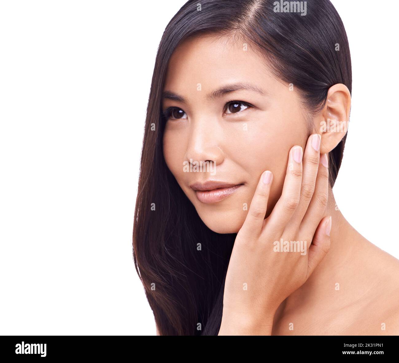 My skin feels amazing. a beautiful young oriental woman against a white ...