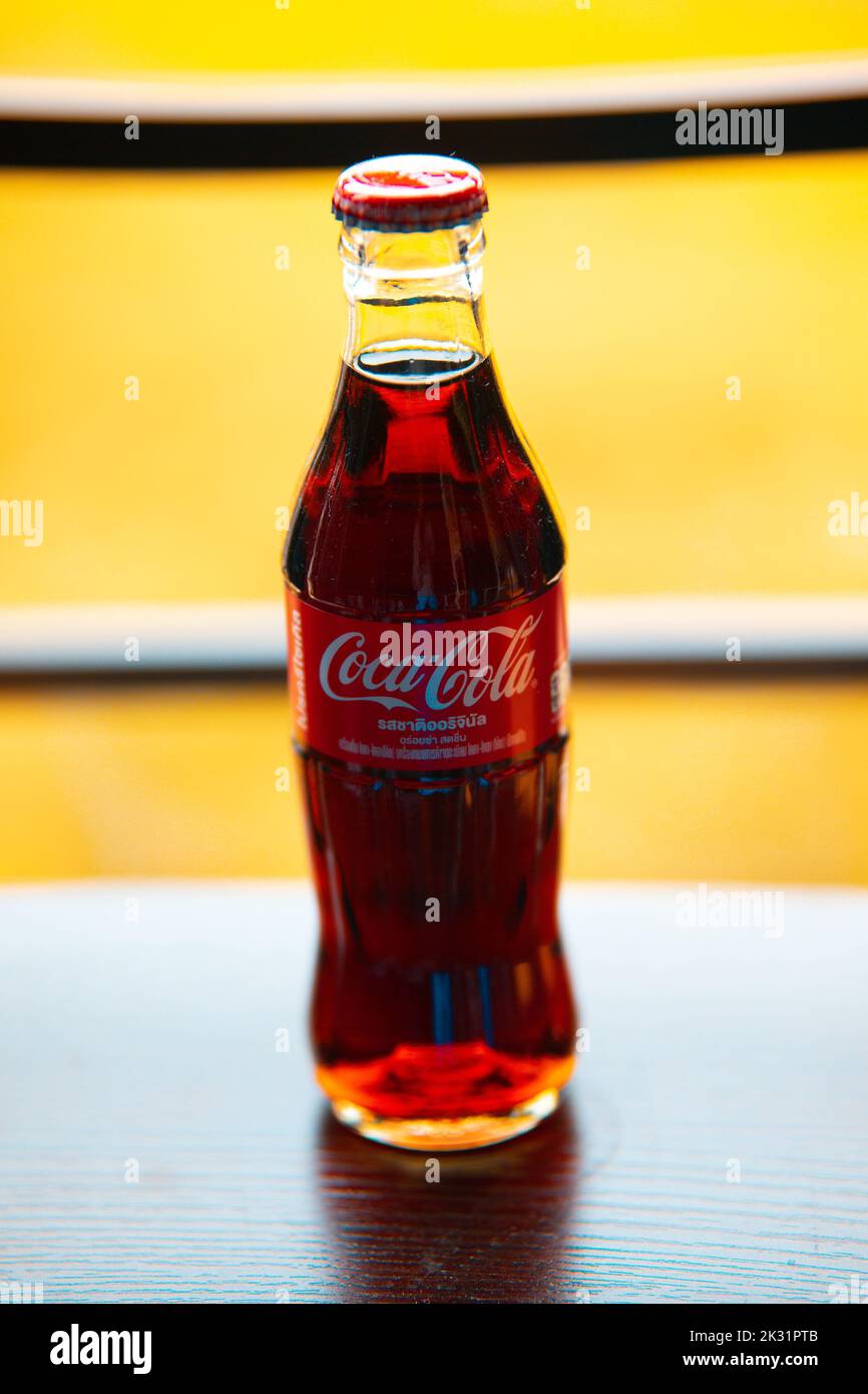 A closeup vertiacal shot of a Bottle of Coca Cola Drink Stock Photo - Alamy