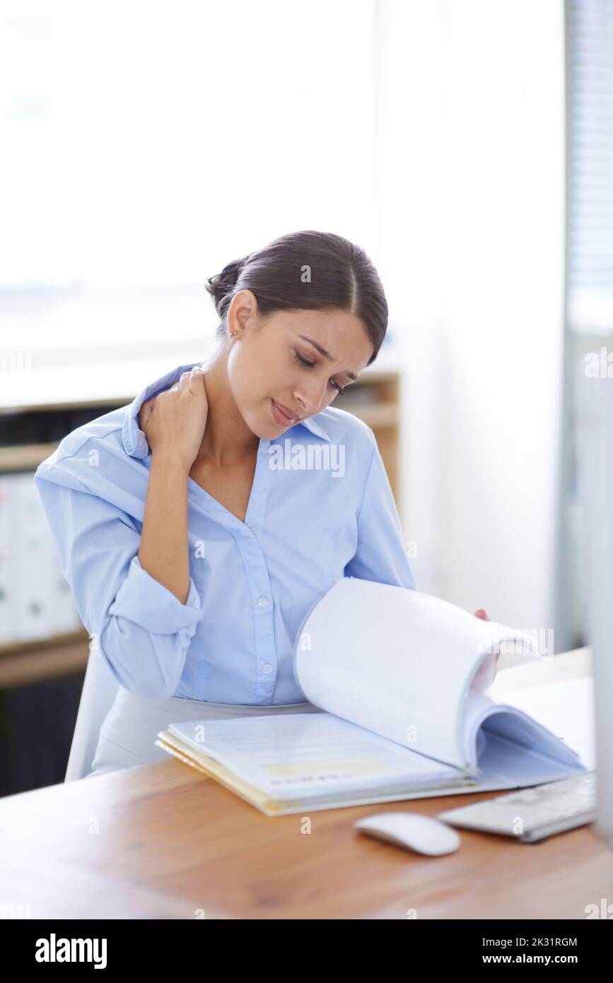 My poor neck muscles...a beautiful young woman working at her desk in ...