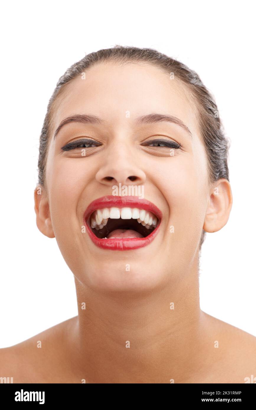 Beautiful laughter. Studio shot of a beautiful young woman laughing ...