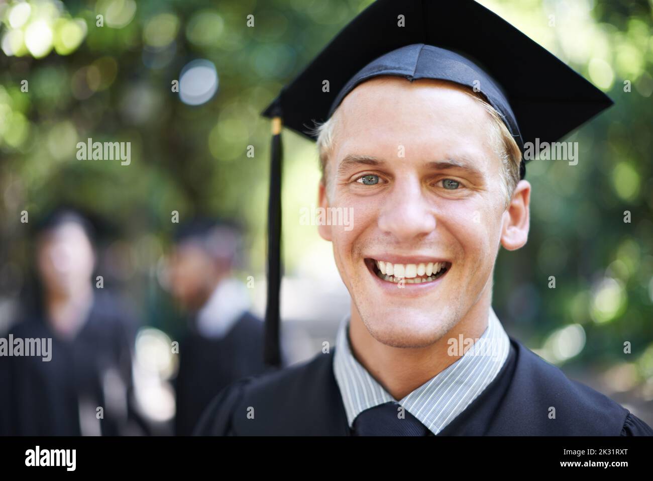 Ive waited my whole life for this day. Portrait of a happy male student ...