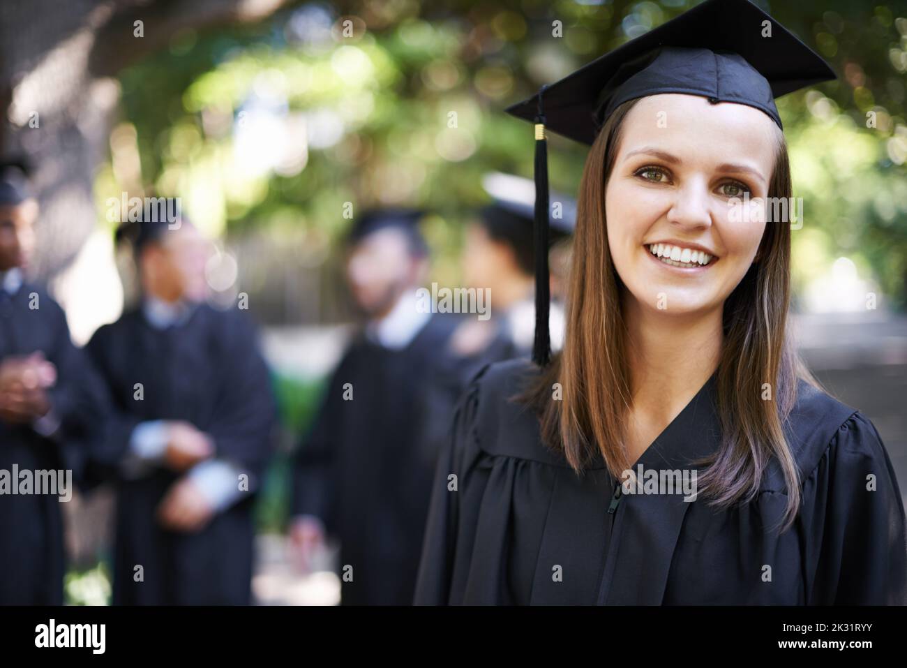 Theyre proud graduates. Portrait of a happy female student on ...