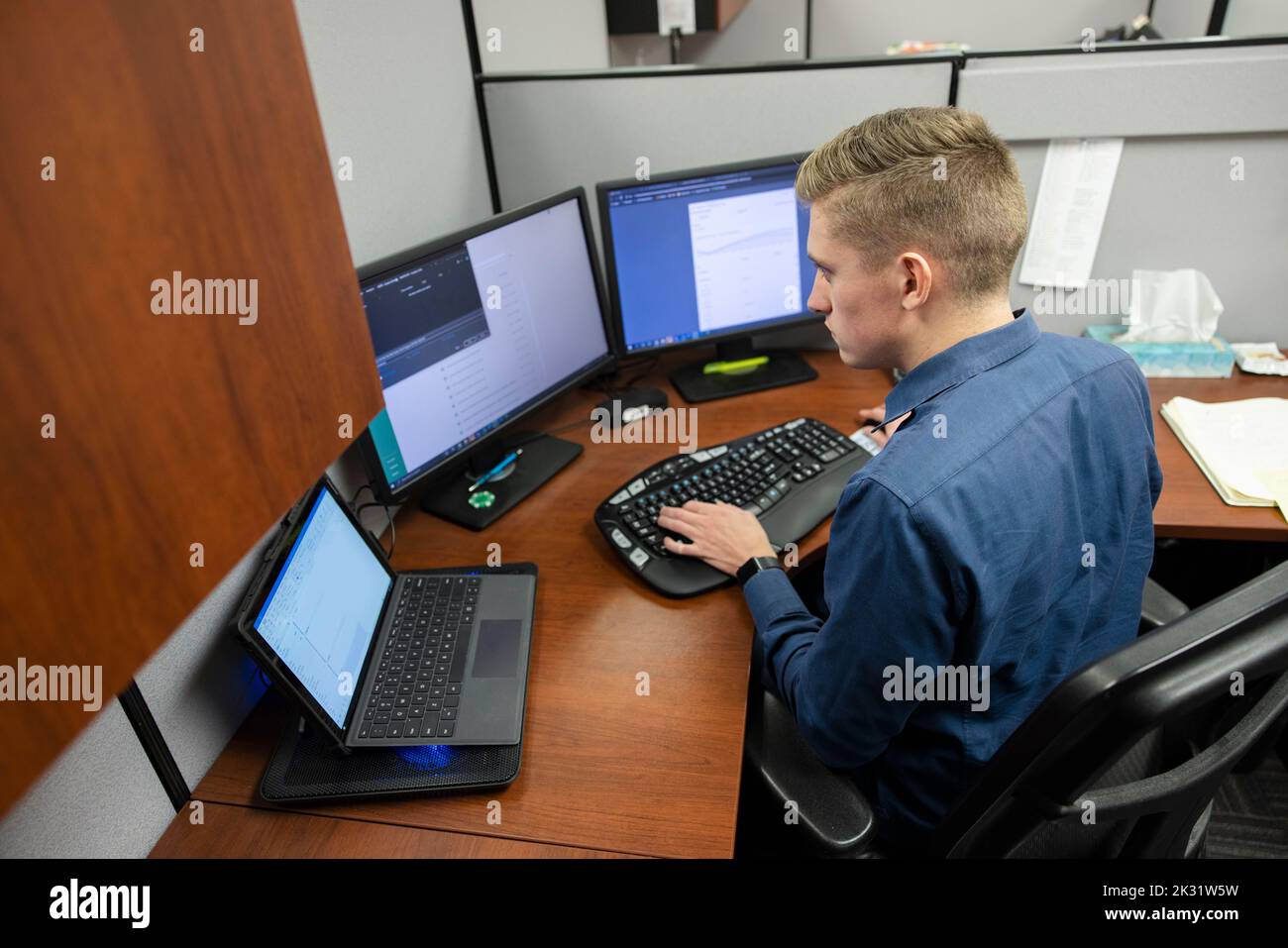 Back of man at computer hi-res stock photography and images - Alamy