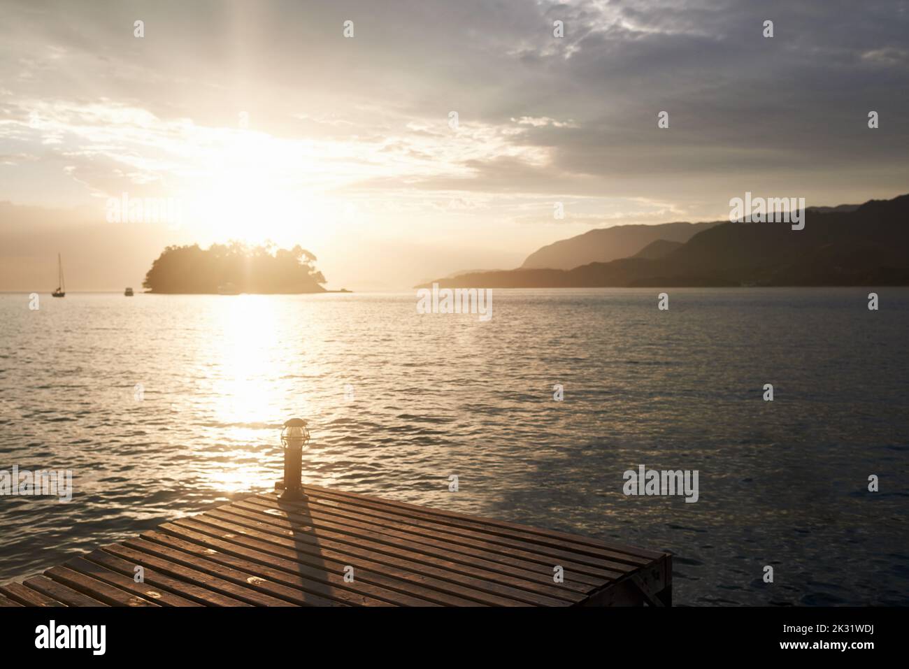 The birth of a new day. a beautiful ocean with a golden sunset Stock ...