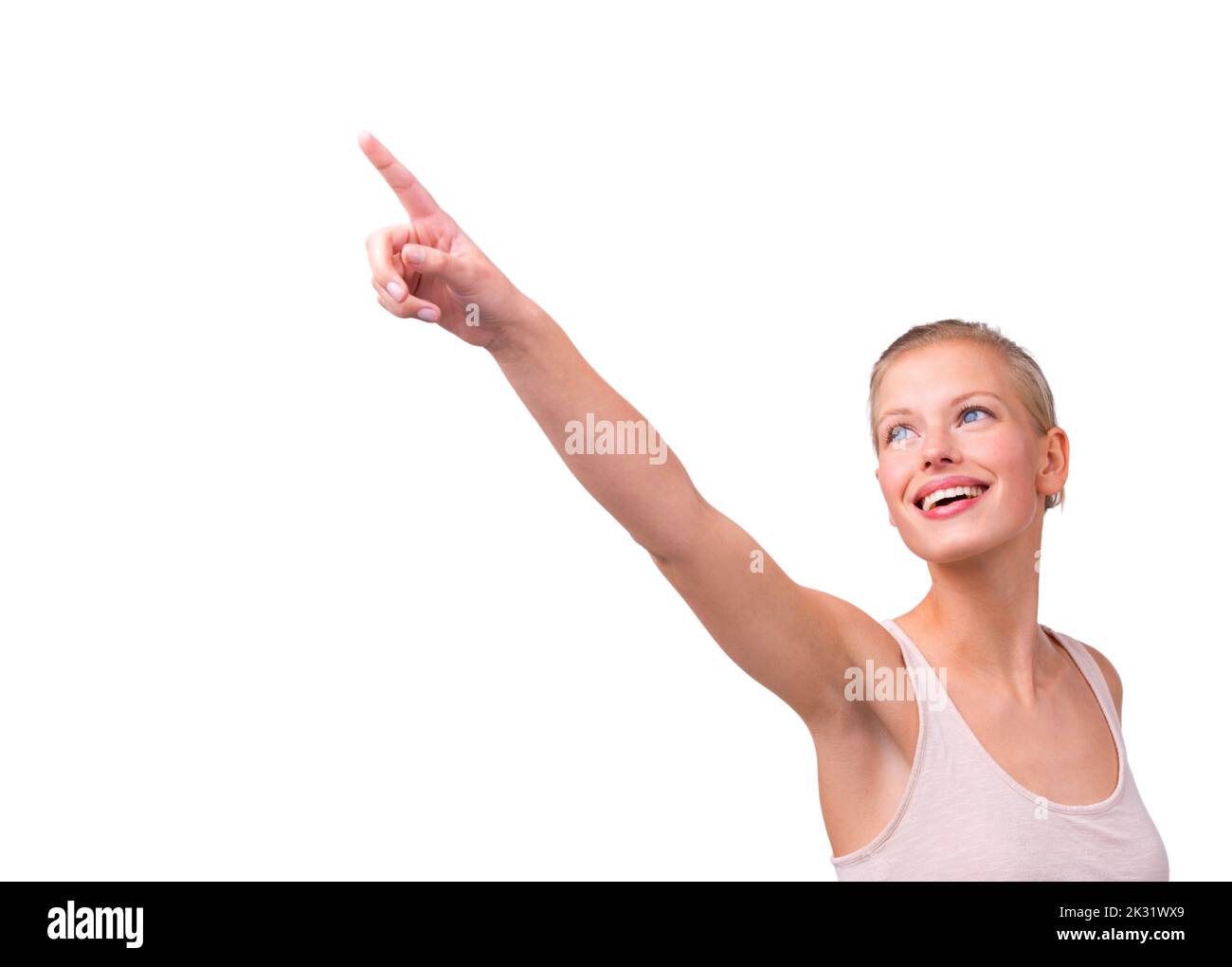 She knows the way. a beautiful young woman pointing isolated on white ...