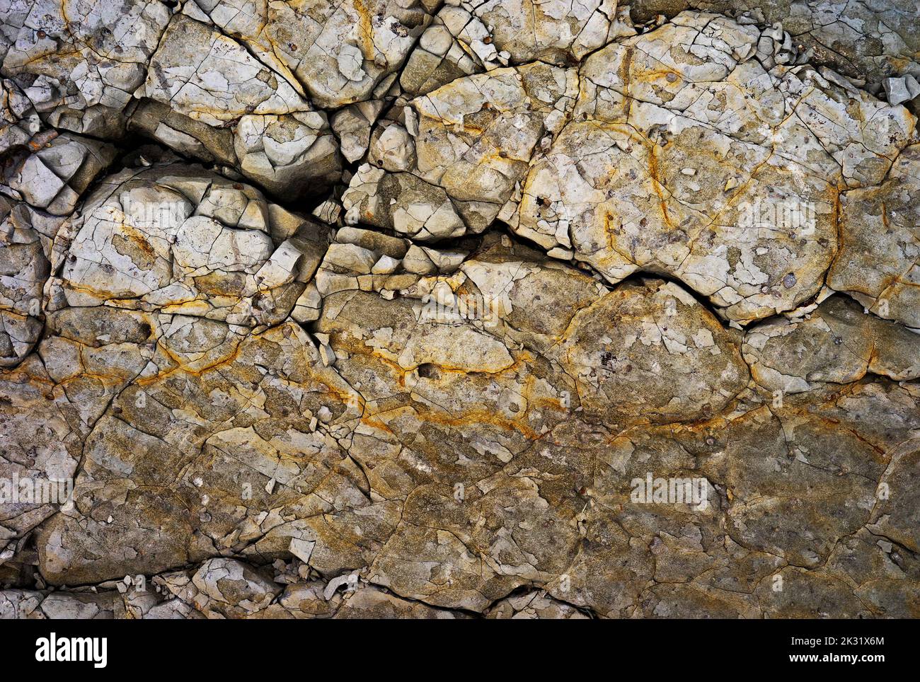 Close formation of a cracked layers of rocks with small details Stock ...