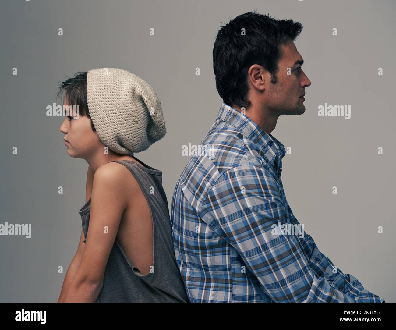 Its hip to be hip. Studio shot of a trendy father and son back to back ...