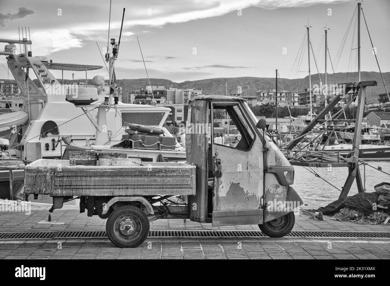An old vessel parked in port of Manfredonia in black and white Stock ...