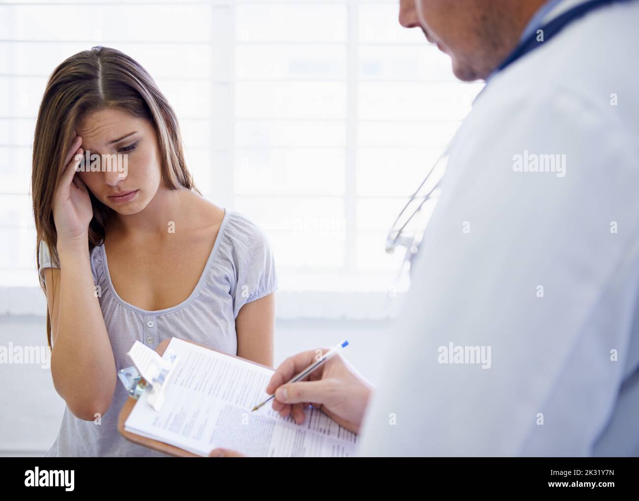 And the headaches started when. A young woman looking concerned during ...