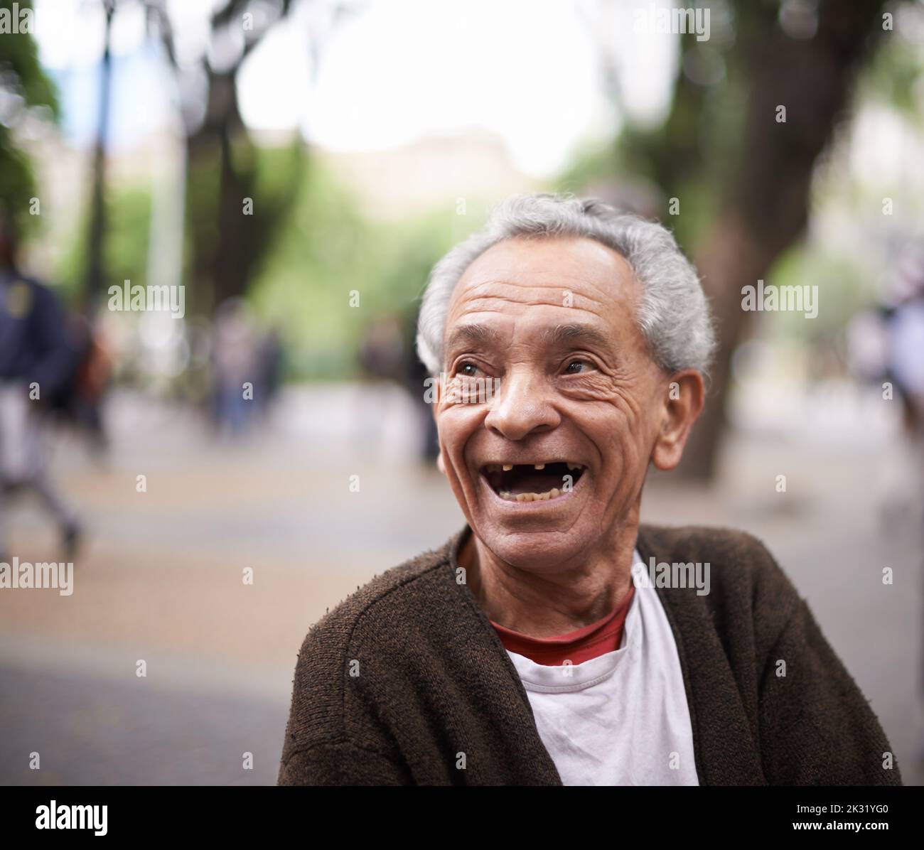 Hes lived quite the life. smiling old man sitting outside Stock Photo ...