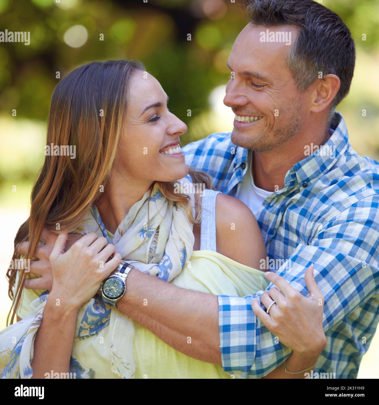 Hes got the look of love. an affectionate couple embracing in the ...