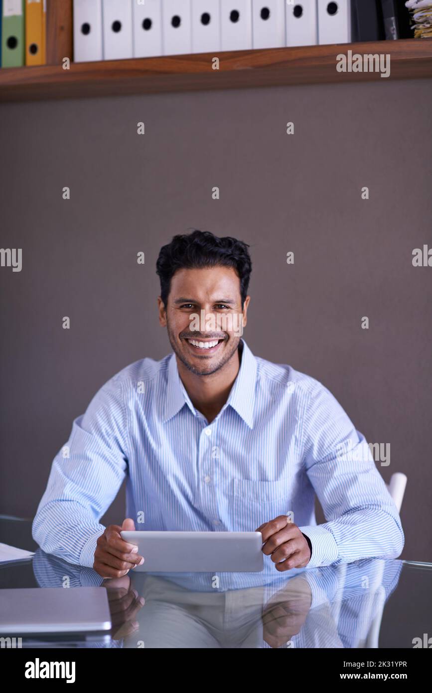 Hes working hard to complete his tasks. a handsome young businessman ...