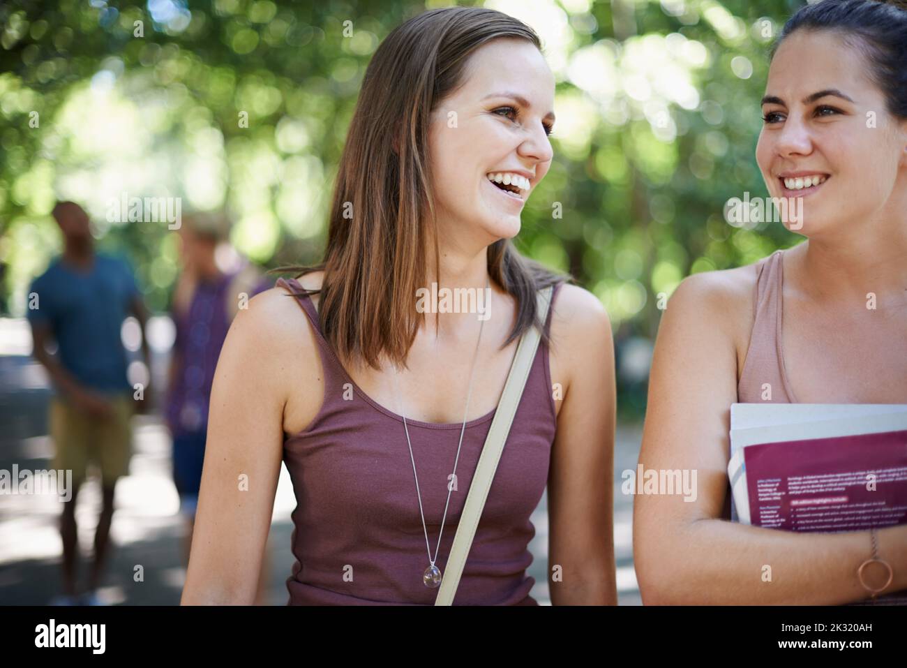 Friendship and laughter. college students hanging out on campus Stock ...