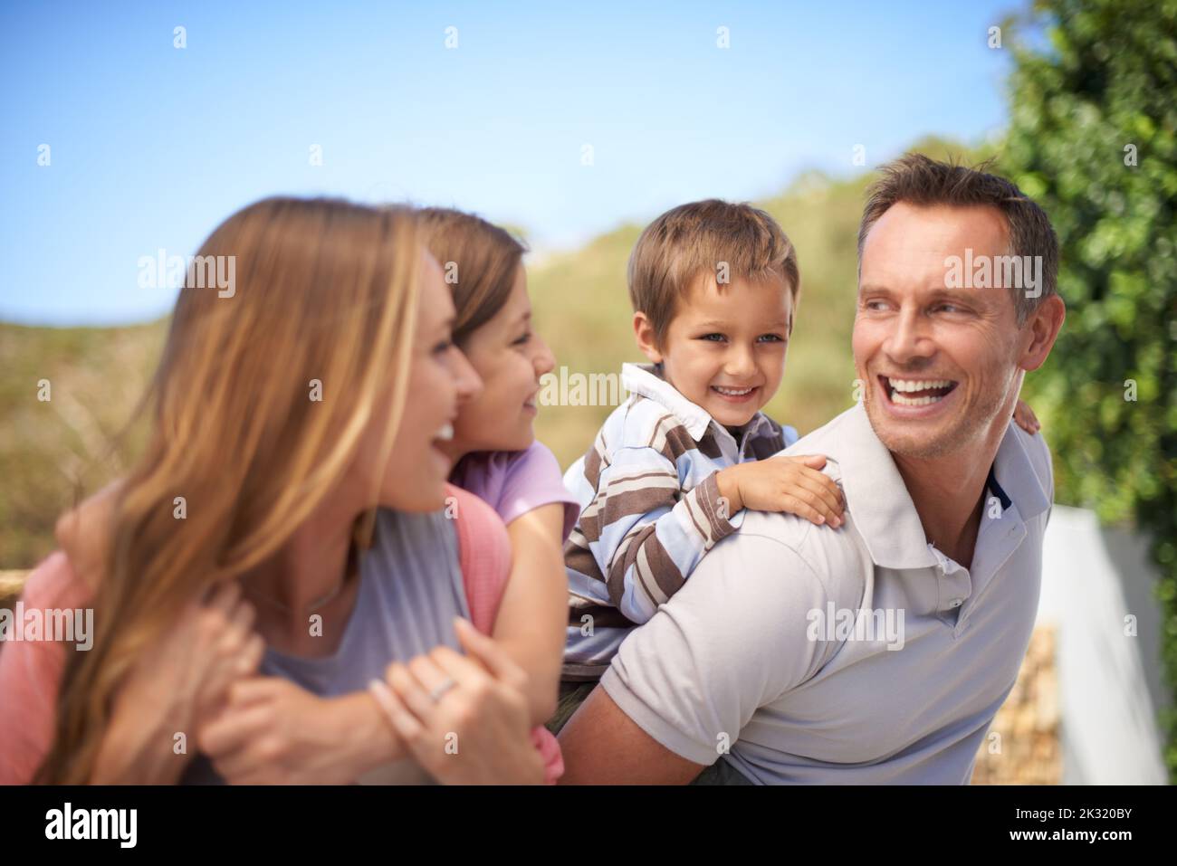 Family bonding in the outdoors. an affectionate family having fun while ...