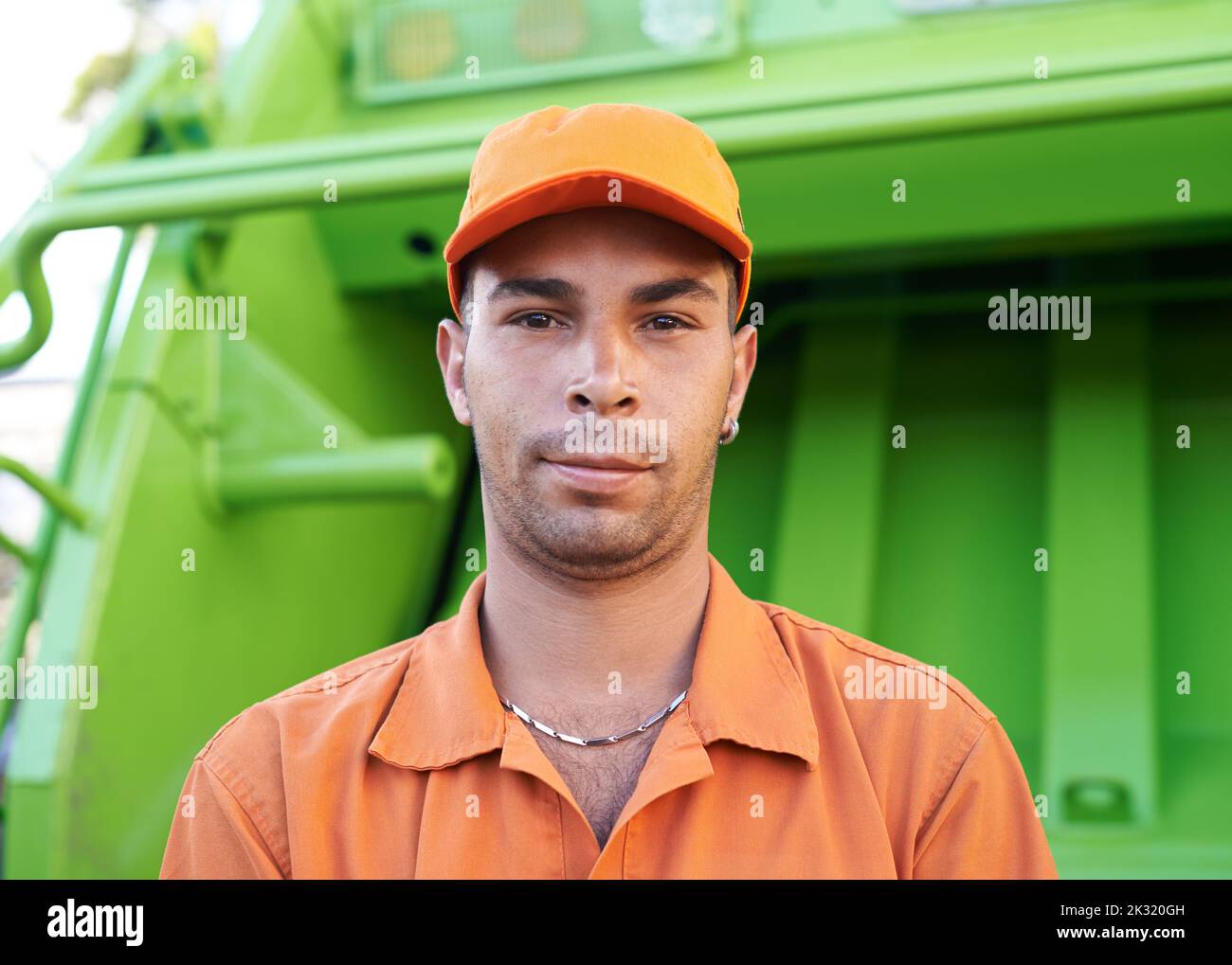 Hes keeping our streets clean. a male worker on garbage day Stock Photo ...