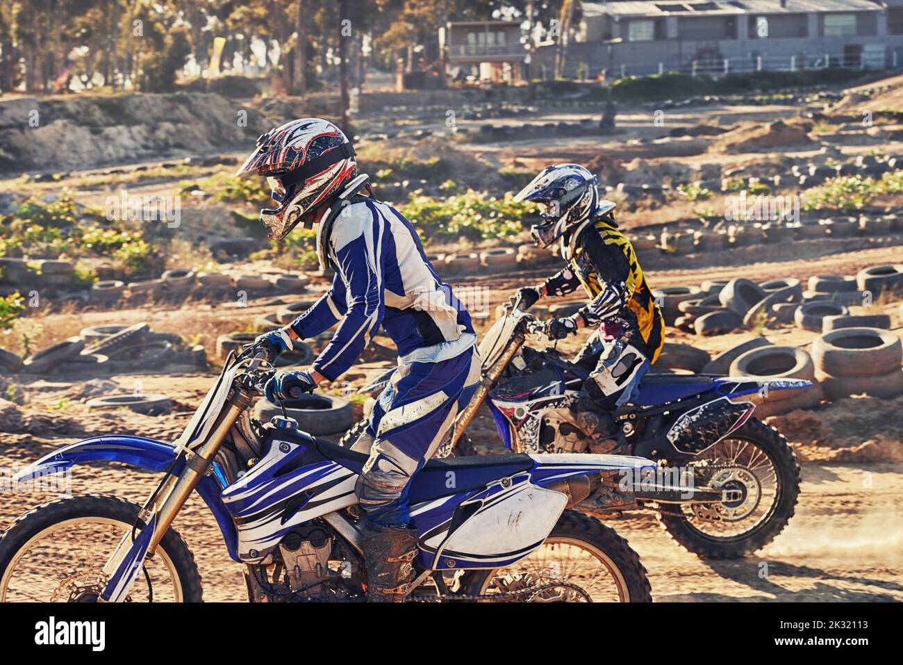 Hes edging into the lead. two motocross riders racing each other with ...