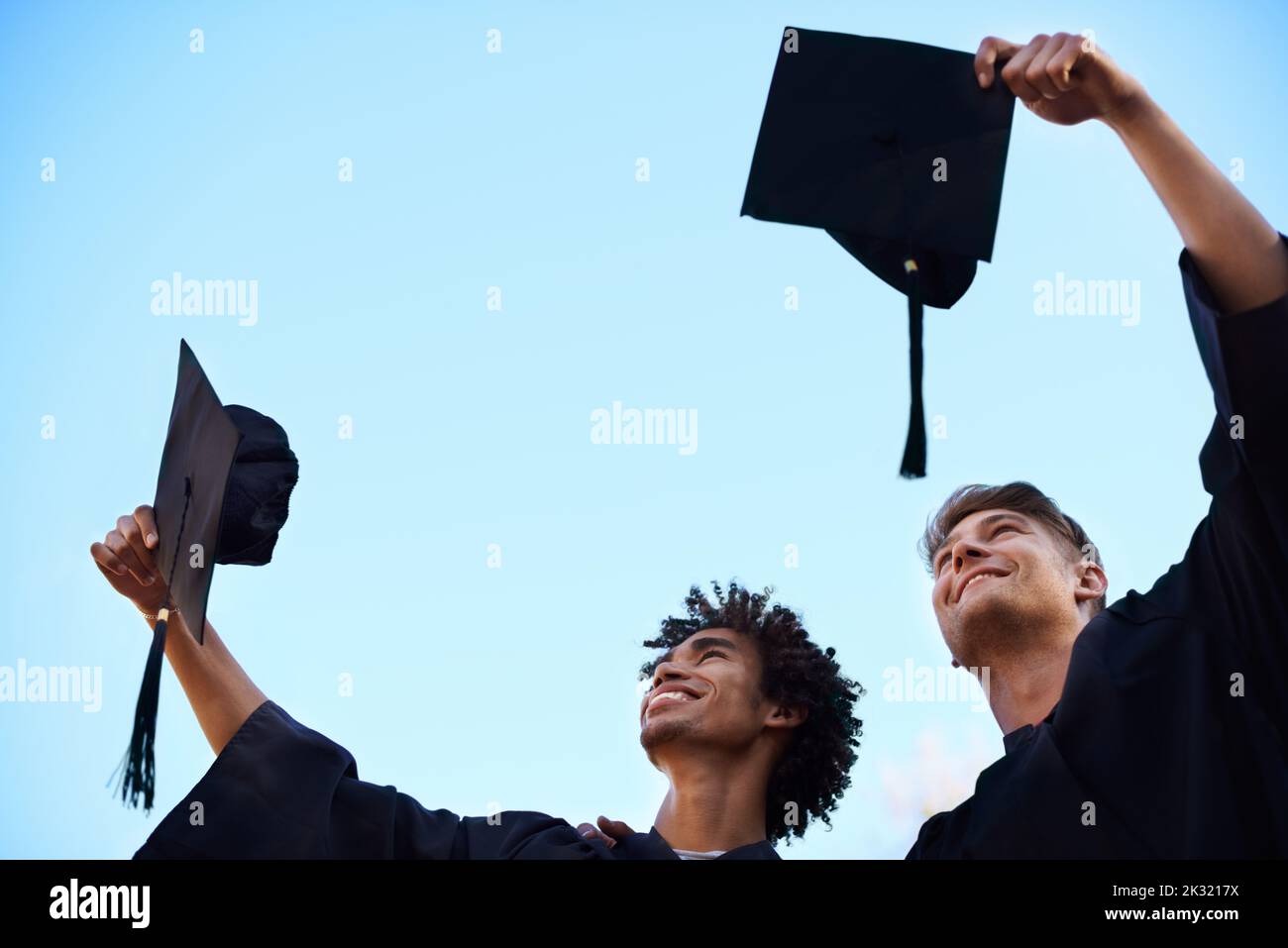 All the hard work paid off. students celebrating on graduation day ...
