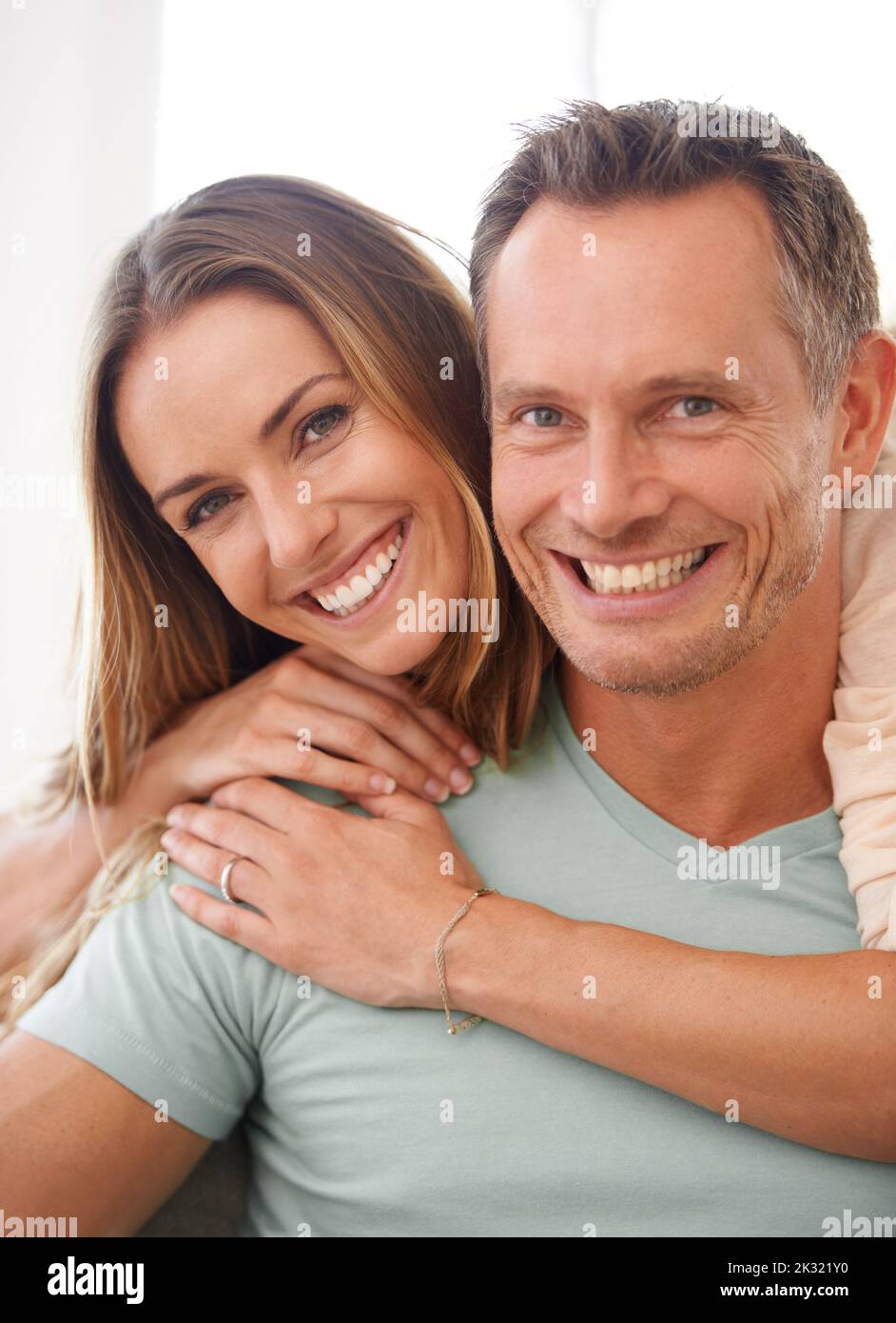 The perfect couple. Portrait of a happy and affectionate couple smiling ...