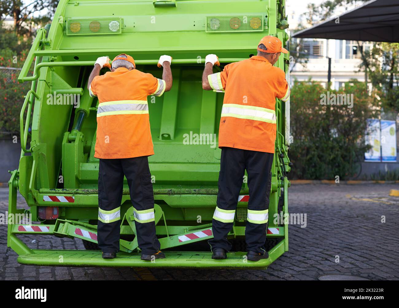 Keeping the city clean. a team of garbage collectors Stock Photo - Alamy
