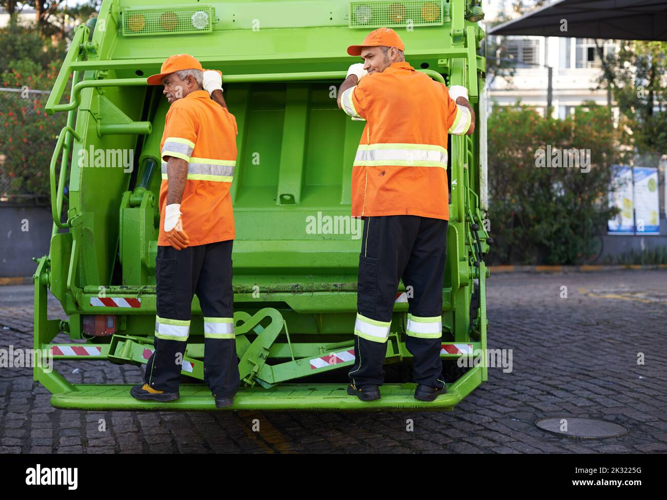 Keeping the city clean. a team of garbage collectors Stock Photo - Alamy