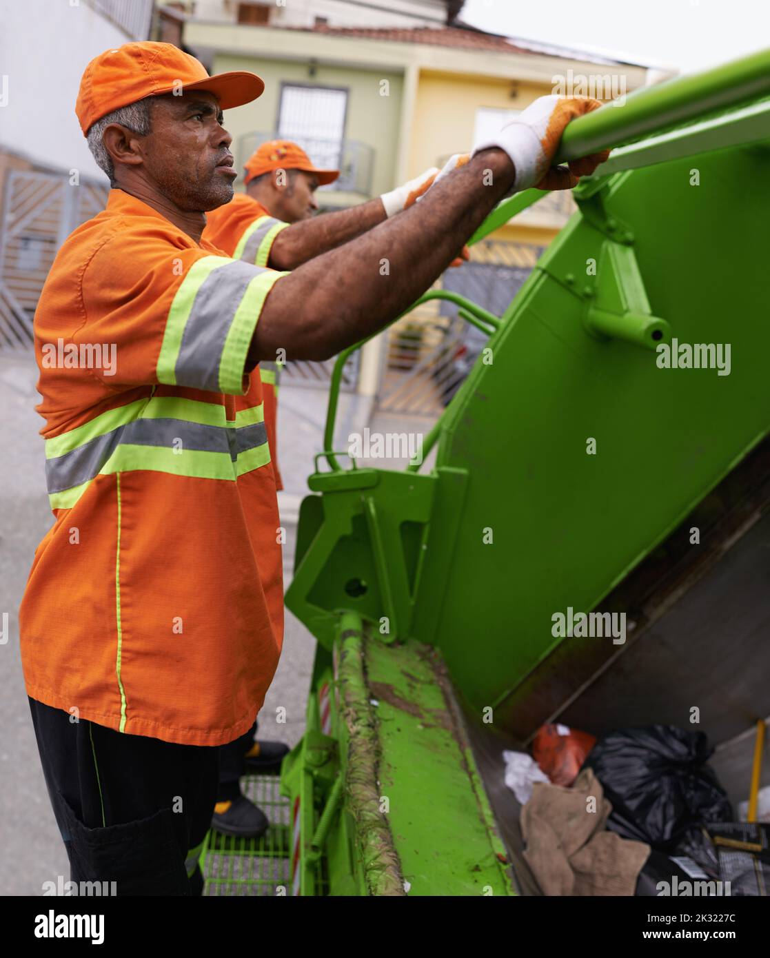 Keeping the city clean. a team of garbage collectors Stock Photo - Alamy
