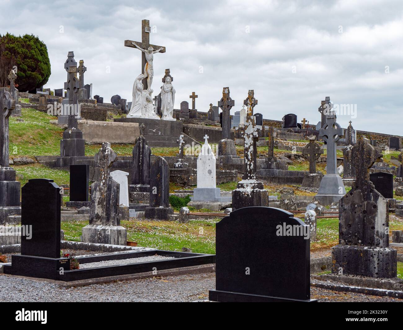 West Cork, Ireland, May 2, 2022. An Catholic cemetery on a cloudy day ...