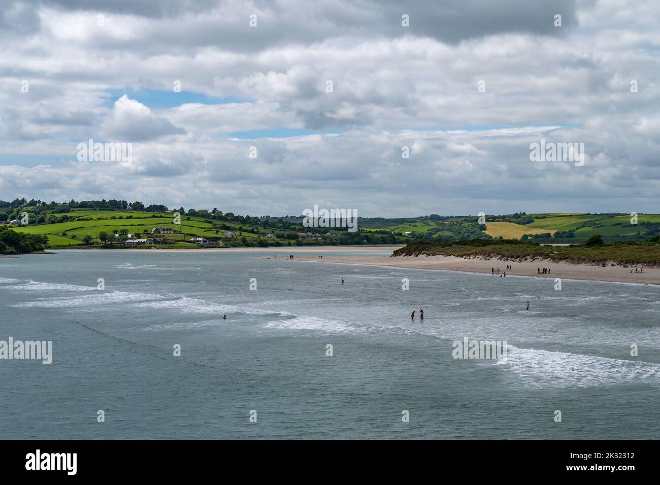West Cork, Ireland, June 12, 2022. Many people on the sandy beach of ...