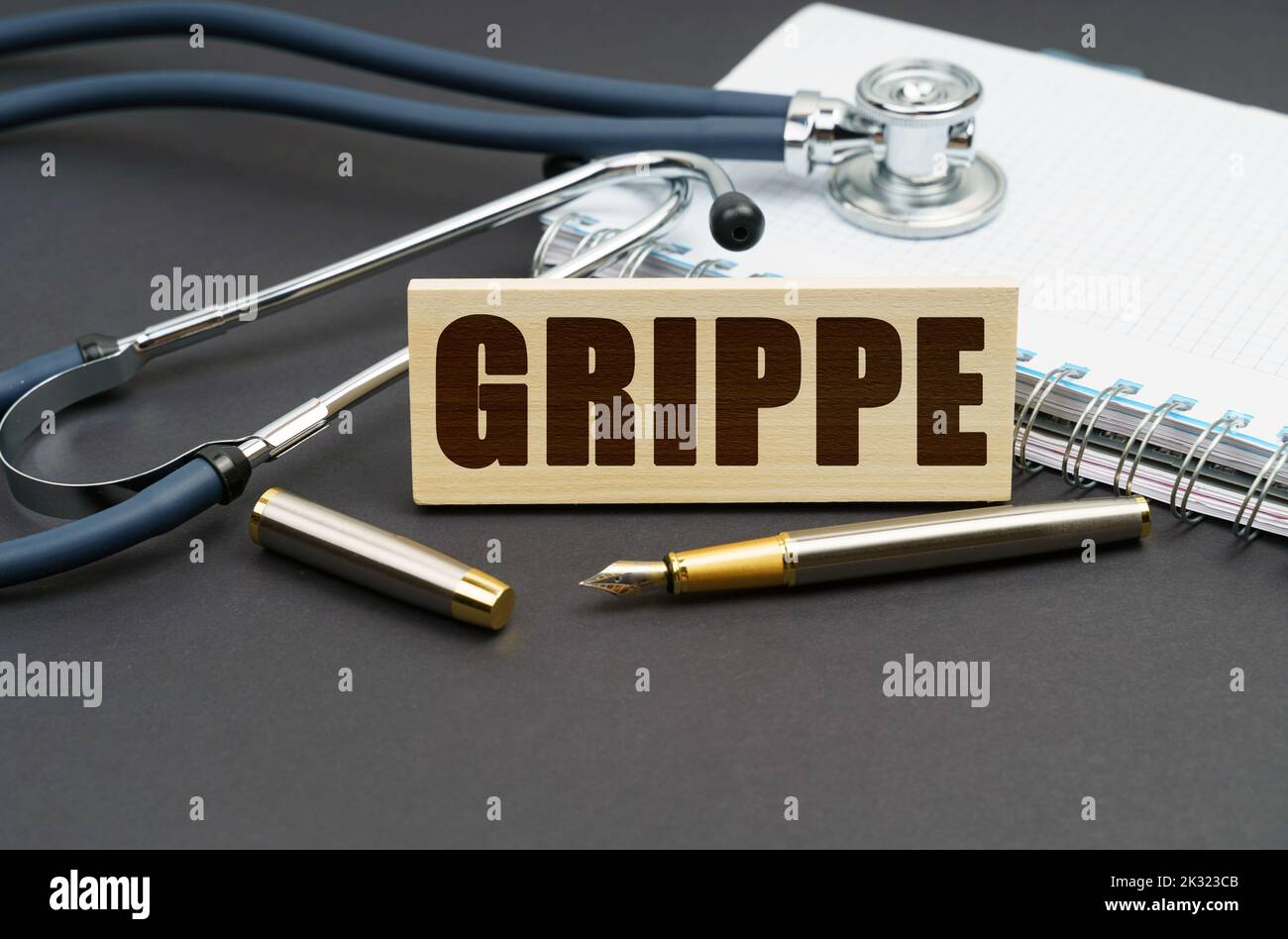 Medicine concept. On the table is a notebook, a stethoscope and a sign ...