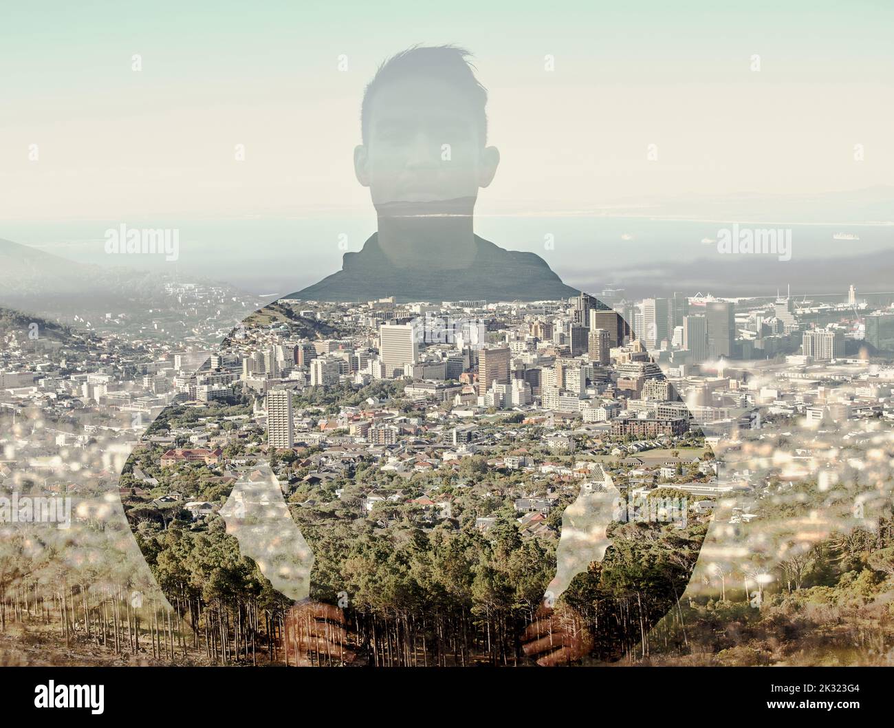 Overlay of man, double exposure of city and forest standing confident ...