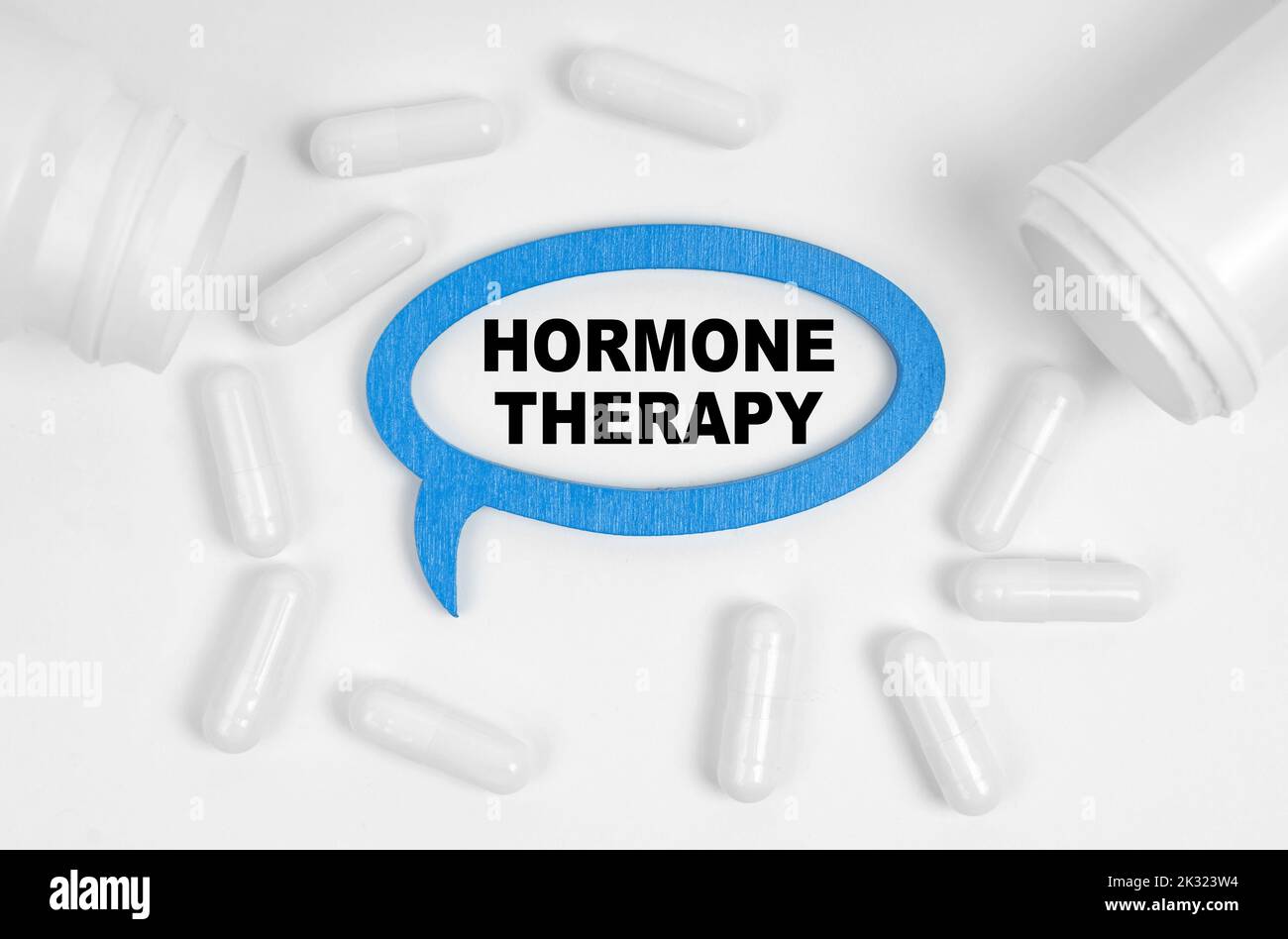 Medicine concept. On the table there are pills and a blue plaque inside ...