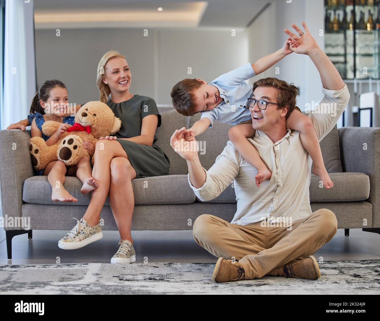 Happy family, children playing and caring mom and dad having fun while ...