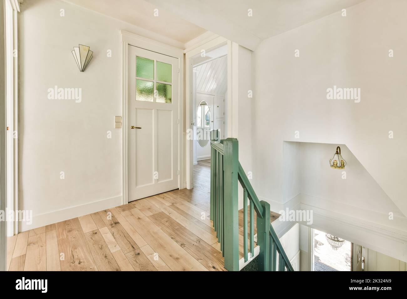 Light narrow hallway with many doors in white walls and glowing lamp ...