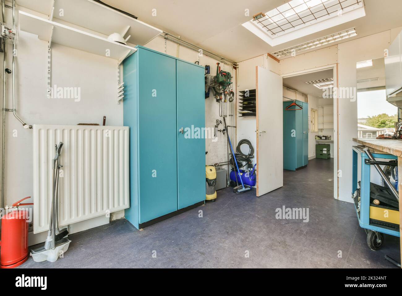 A bright area with a wardrobe and a shelf for storage Stock Photo - Alamy