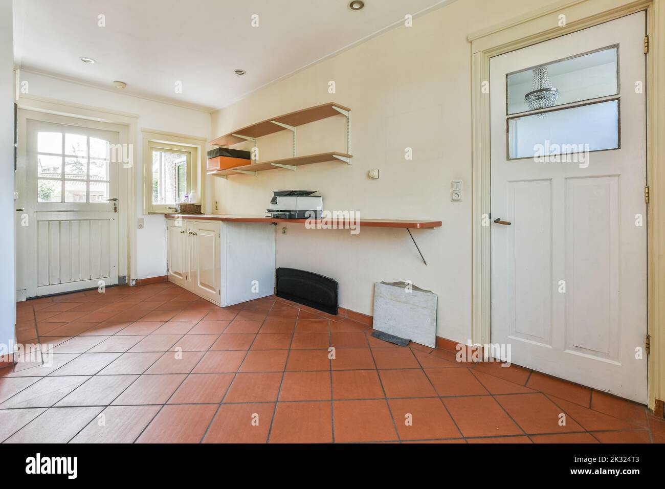 Convenient shelves with a printer Near the window Stock Photo - Alamy