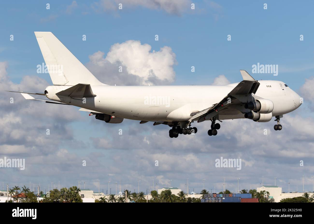 A Boeing 747 cargo freighter plane landing at Miami Airport Stock Photo ...