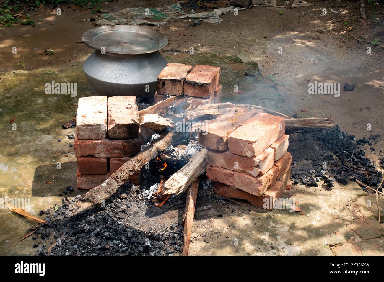 Biryani cooking in a village party on a temporary brick made oven ...