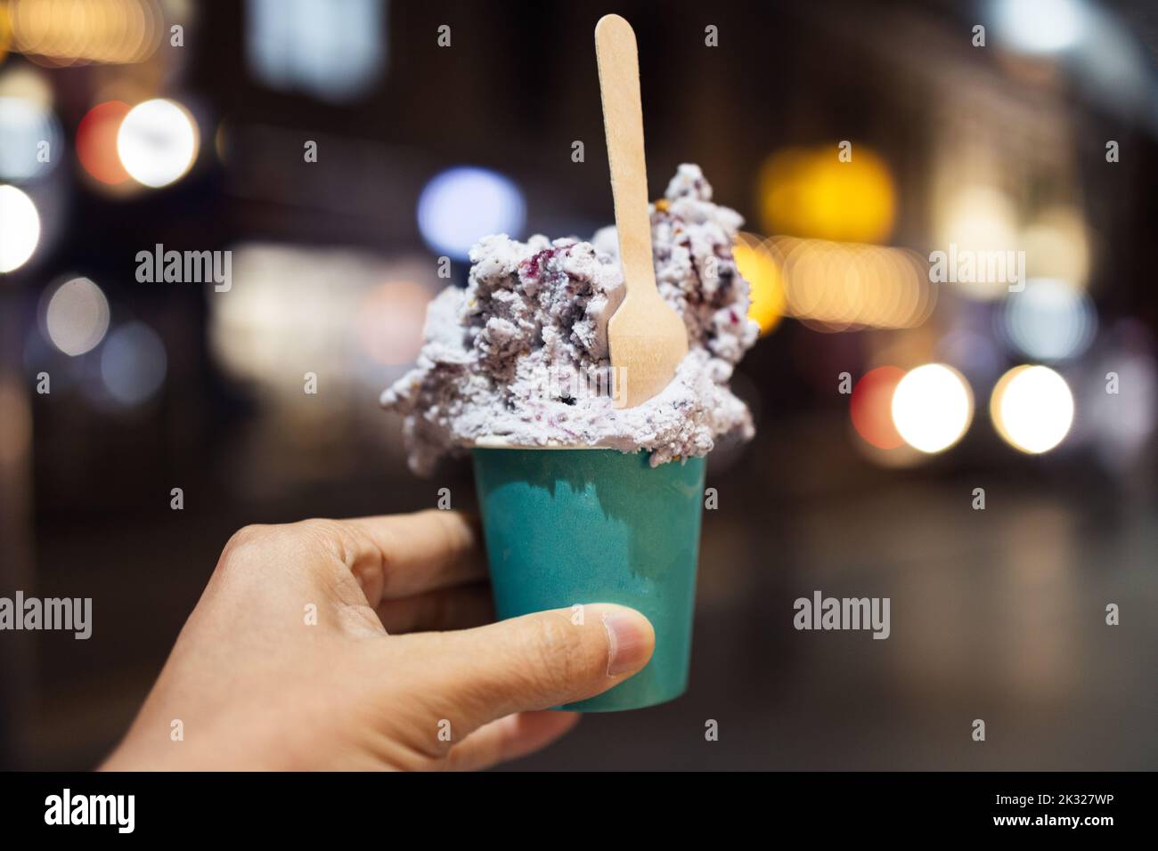 An image of ice cream at night city, concept of holiday, relaxing ...