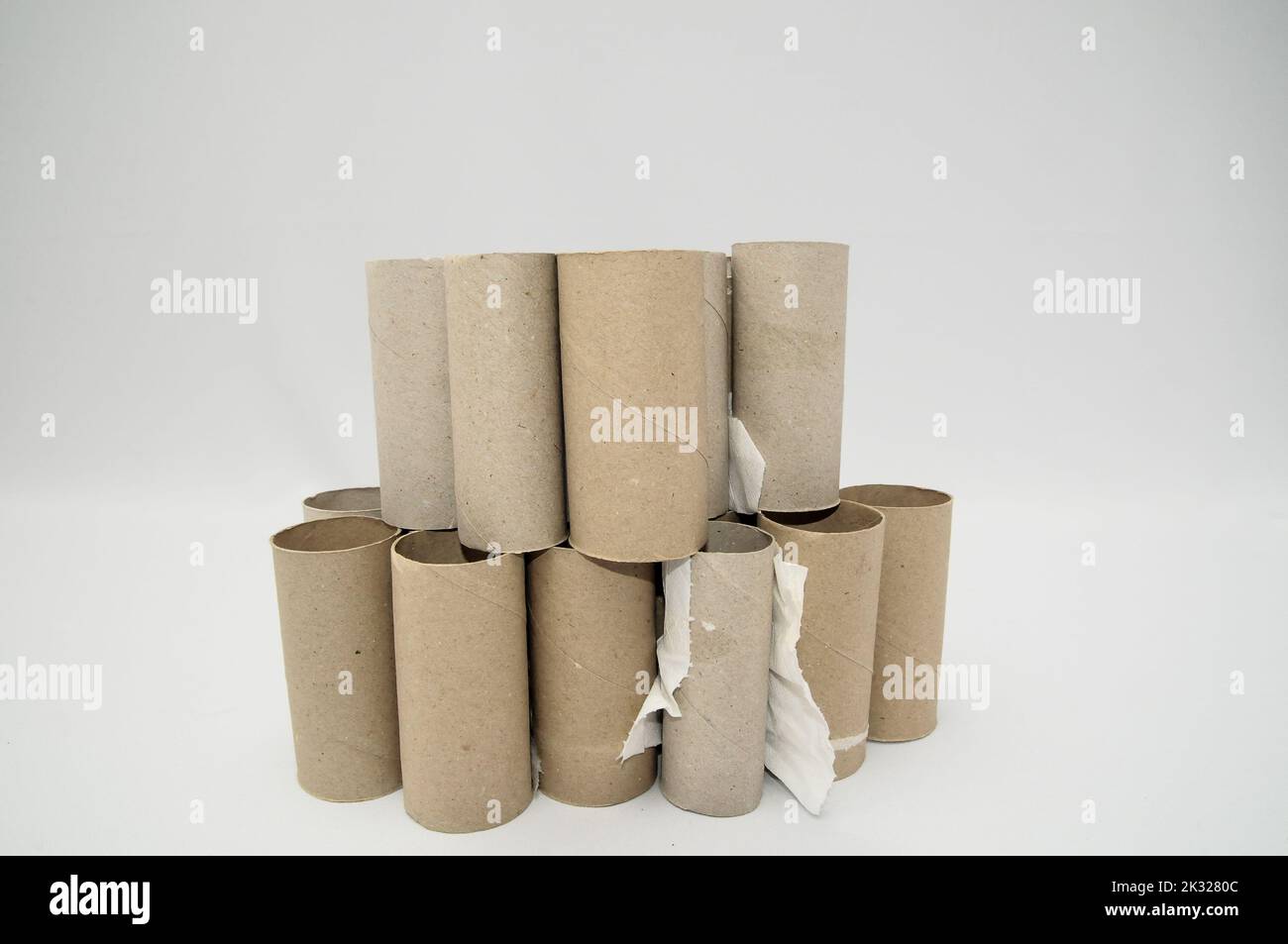 A stack of empty toilet paper rolls isolated on white background Stock ...
