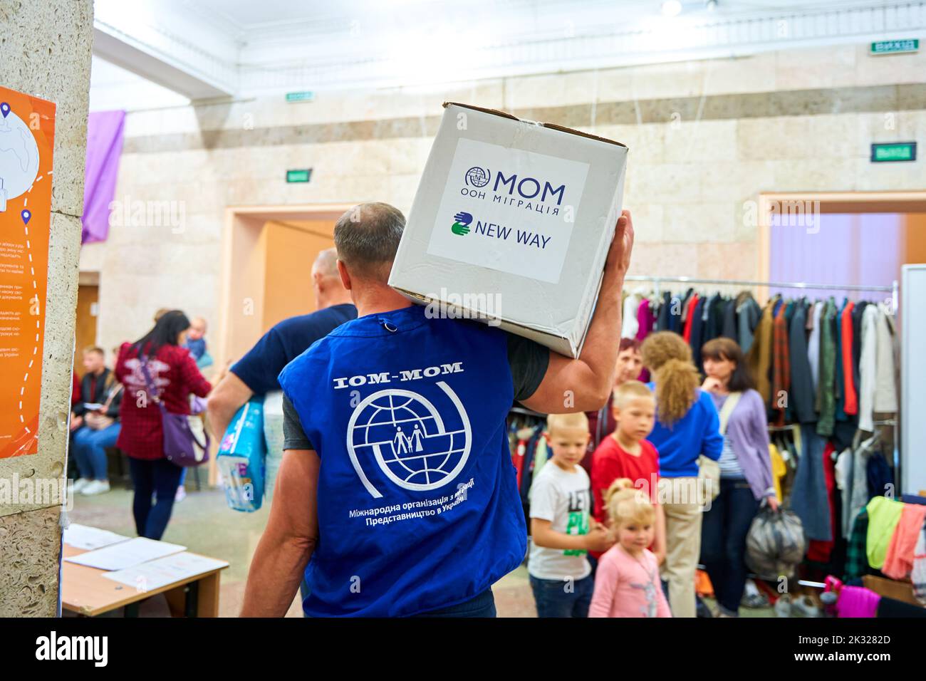 volunteer carrying a box with humanitarian aid. Dnipro, Ukraine - 06.30 ...