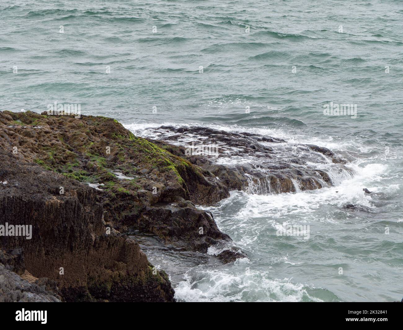 Wild rocks and sea water, landscape, rock formation beside body of ...