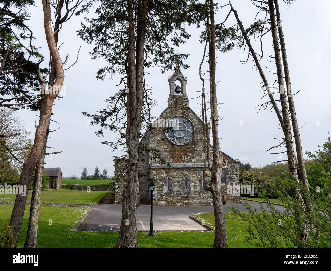 An old stone Christian church in Ireland. Cloudy weather and cloudy sky ...