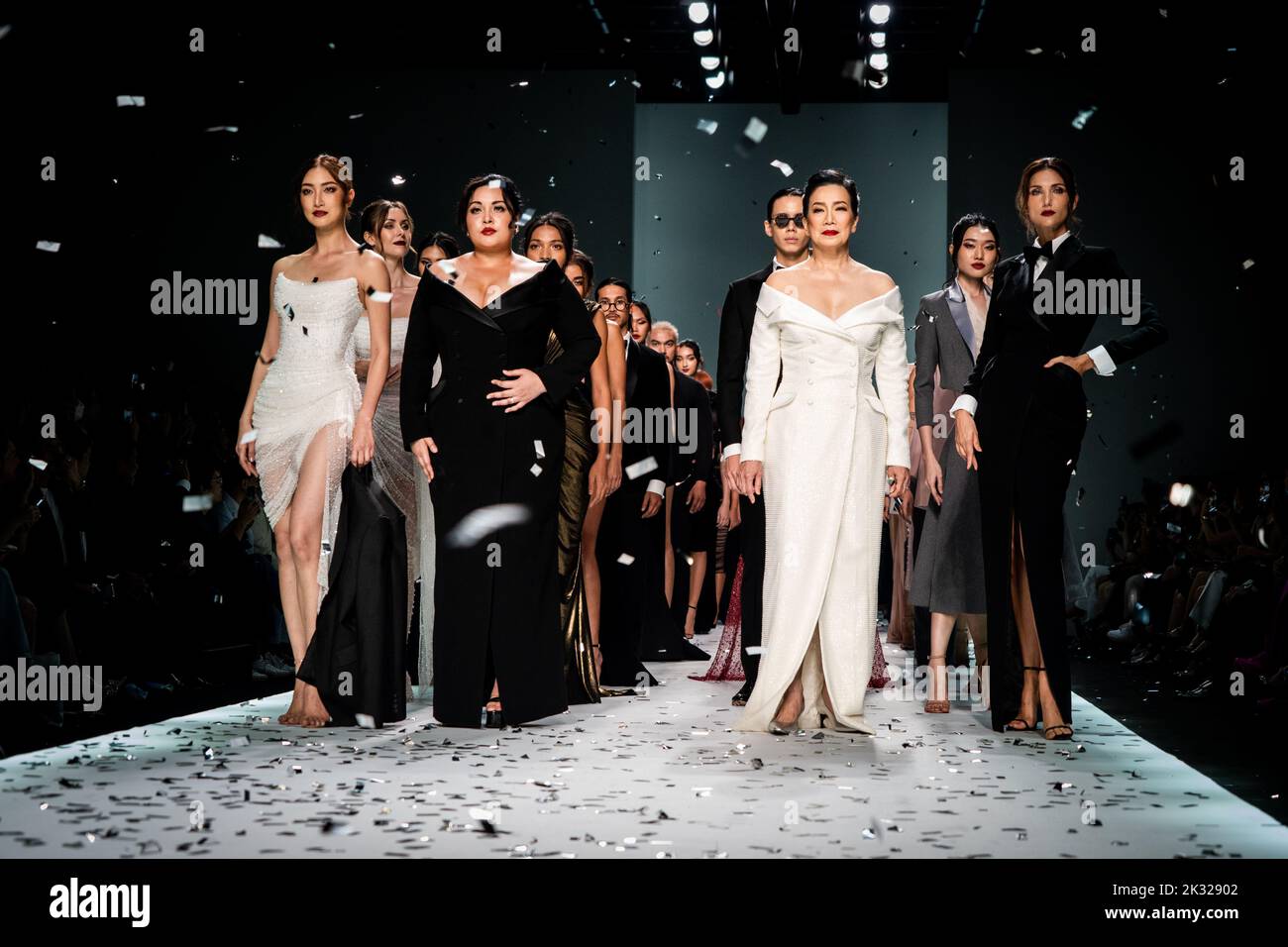Models line up at the close of the runway for the Thai fashion brand ...