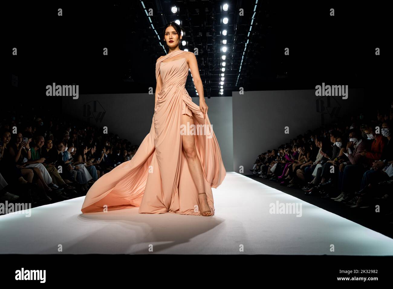 A model walks the runway for the Thai fashion brand POEM at Siam ...