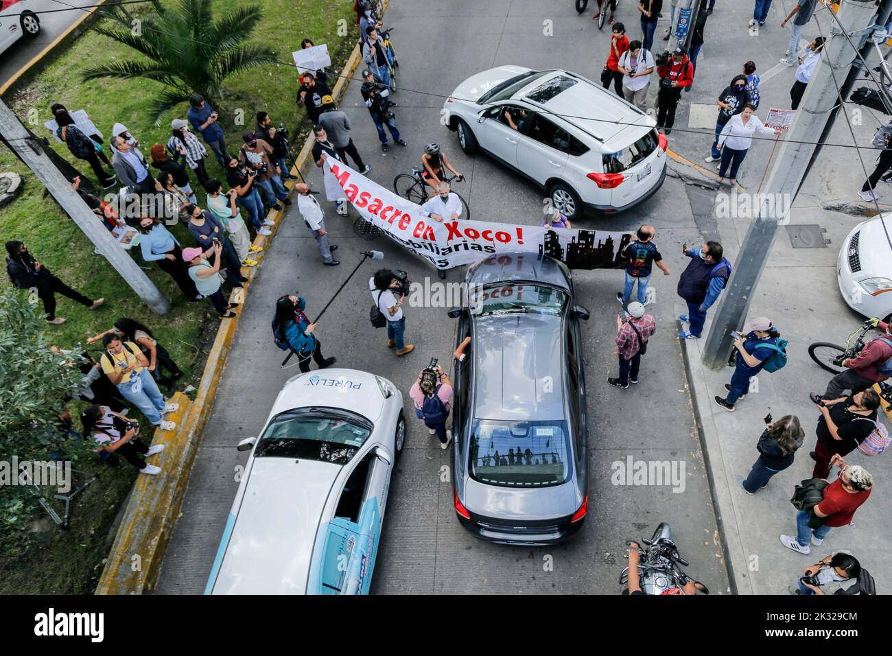 Mexico City, Mexico. 23rd Sep, 2022. Protesters carry a banner during a ...